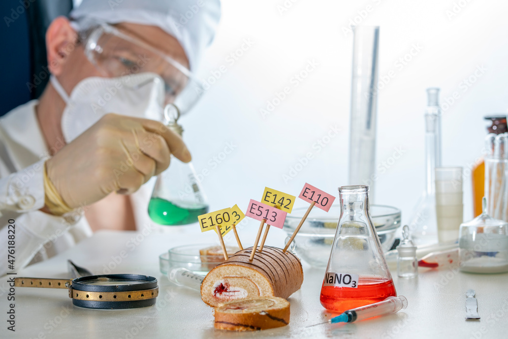 Healthy food concept. The hand of the laboratory assistant is holding a ...