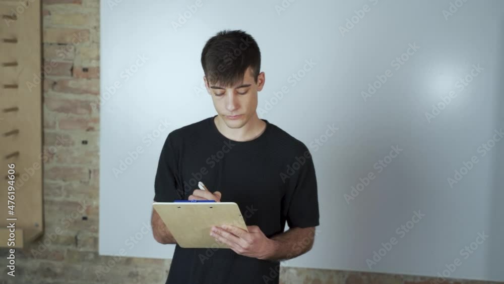 Male student presentation in classroom. Dark hair talking smiling and ...