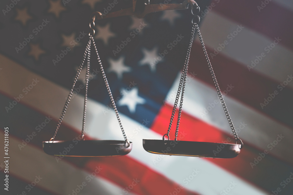 Close up scale of Justice against American flag background as symbol of ...