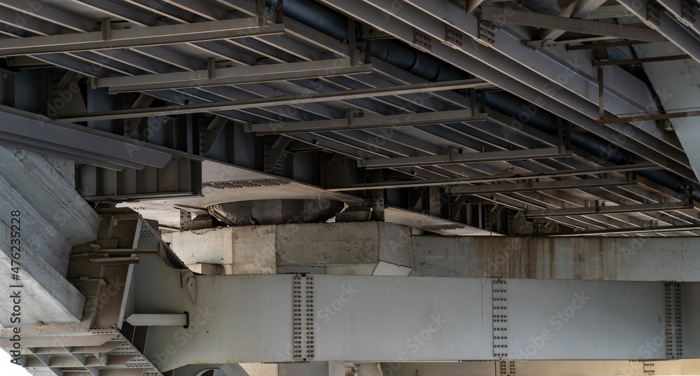 Framework under bridge. Metalwork. From the bottom of large bridge ...