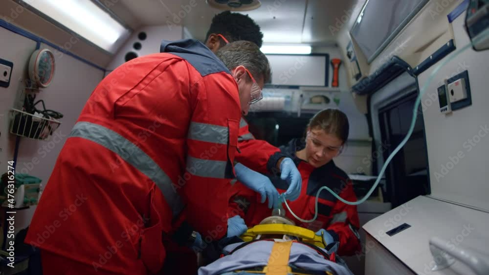 Ambulance doctors saving life of victim in ambulance vehicle Stock ...
