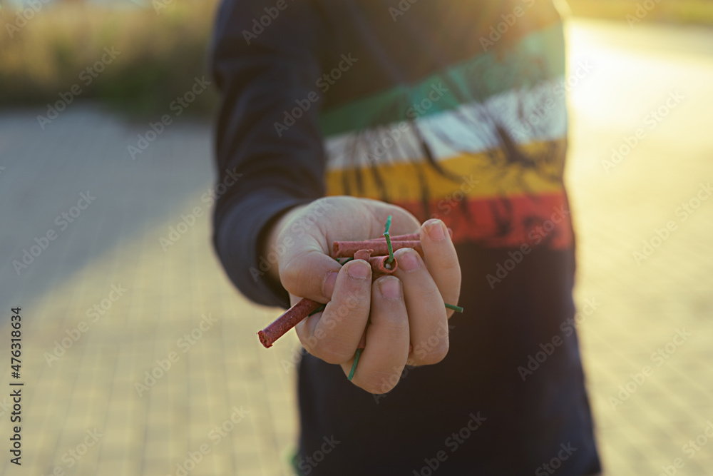 boy showing his hand full of firecrackers in valencian fallas festivals ...