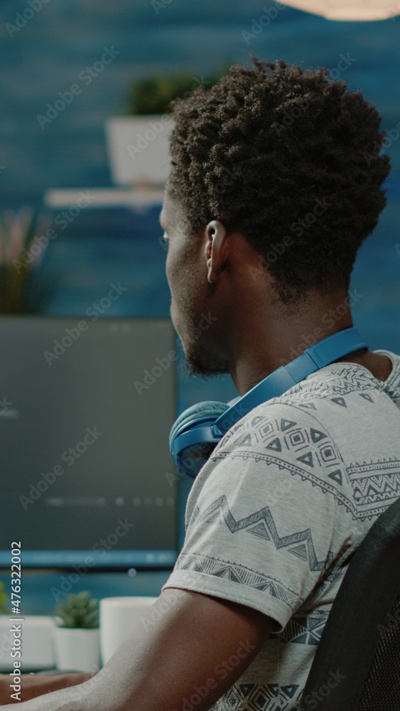 Person programming website firewall with codes on computer. Programmer coding web interface with ...