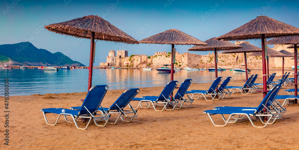 Vacation concept background. Calm summer view of Methonis beach with ...