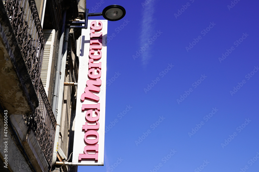 mercure hotel text brand hostel and logo sign building wall facade in ...
