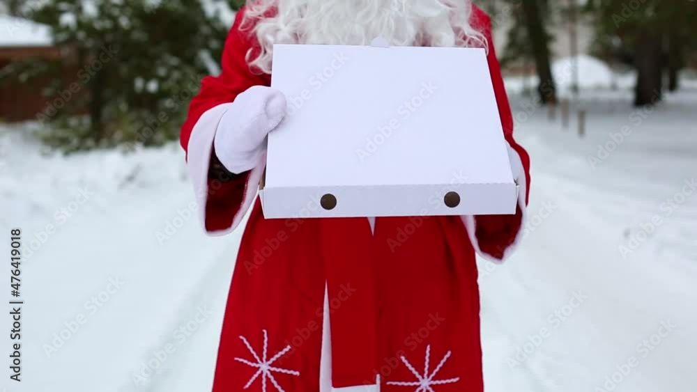 White pizza box open in hands of Santa Claus in white mittens, with ...