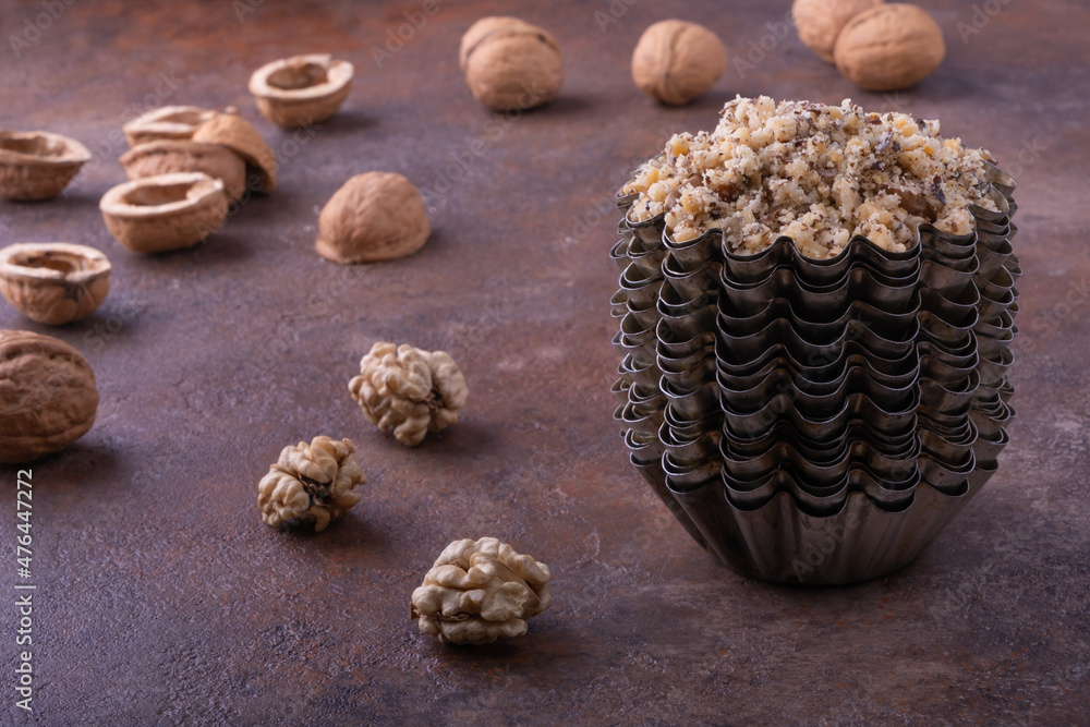 Pounded walnut in a vintage iron baking dish in a pyramid of such forms ...