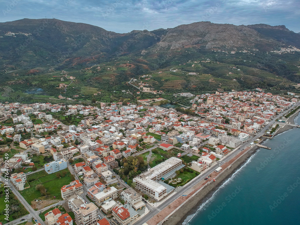 Aerial cityscape view of Neapolis town at sunset. Also named Vatika in ...