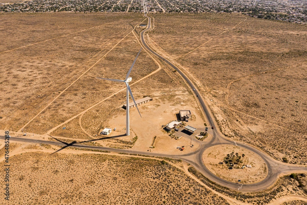 Aerial view of a wind power generator in a desert valley Desert blades ...