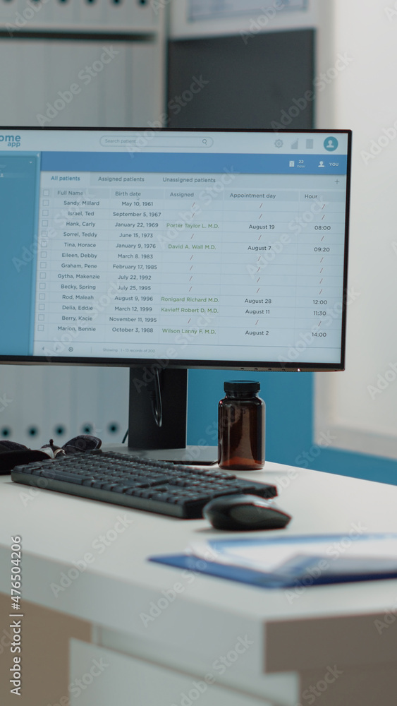 Close up of computer with medical files on monitor in cabinet. Nobody ...