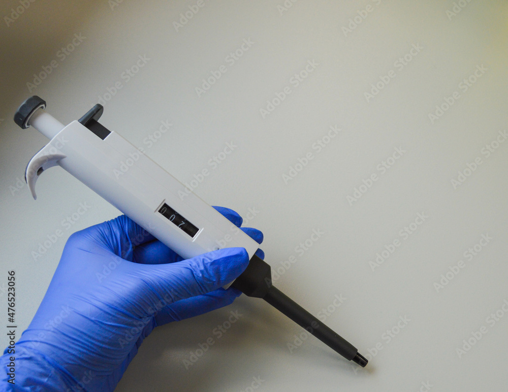 Medic assistant working in biochemistry lab working with automatic ...