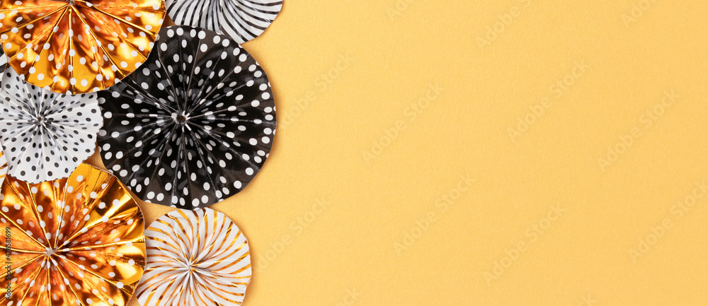 Banner with border frame made of colorful paper fans on a golden ...