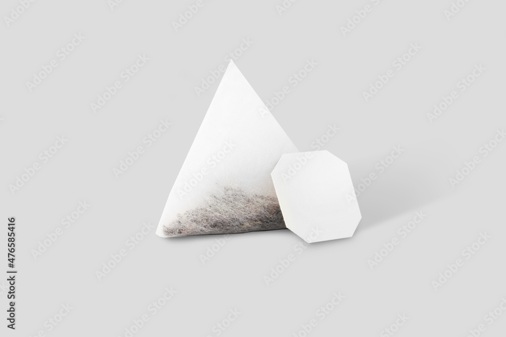 Blank tea bags with label tag and dried leaves inside. Tea box ...