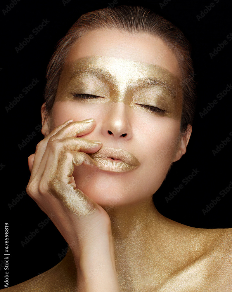 Beauty and makeup concept. High Fashion model girl with golden ...