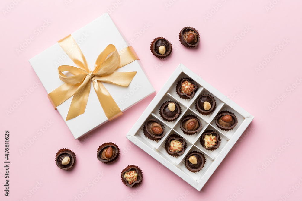 White box with chocolates candies and golden tape. top view with copy ...