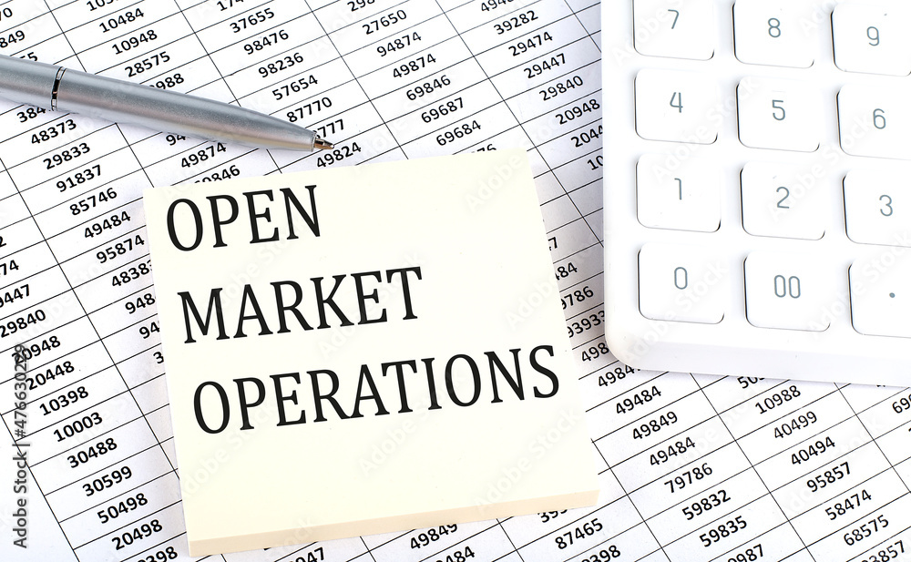 OPEN MARKET OPERATIONS - business concept, message on sticker on chart ...