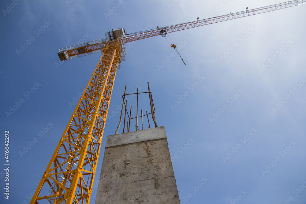 Tower crane and concrete base of the building. Construction crane on ...