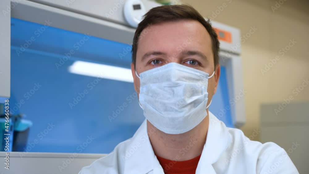 Chemistry lab researcher man says yes and nods his head in biomedical ...