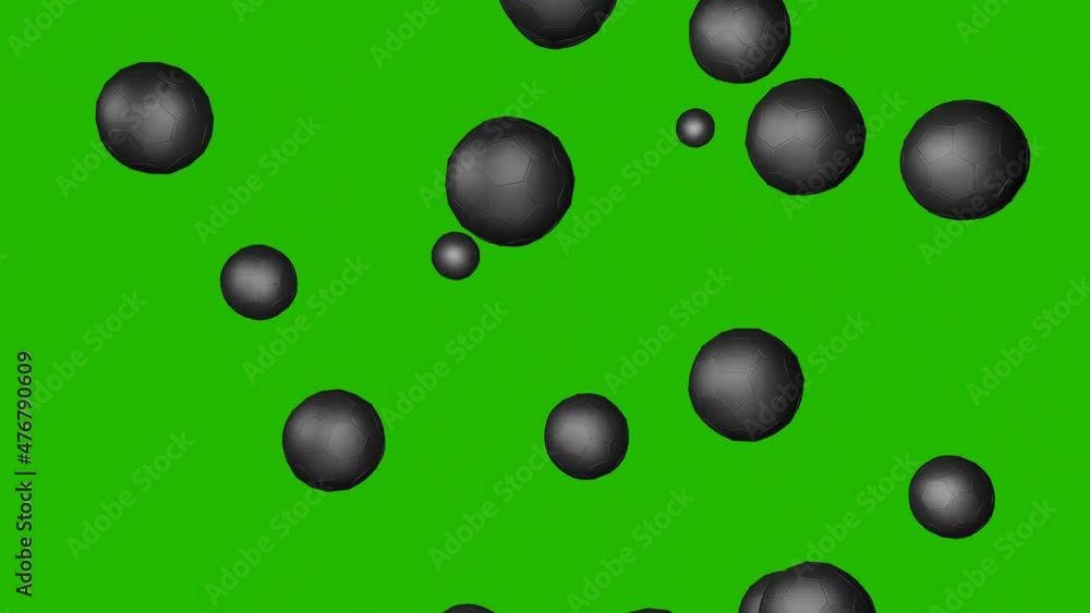 Black soccer (football) balls are falling against a green screen ...