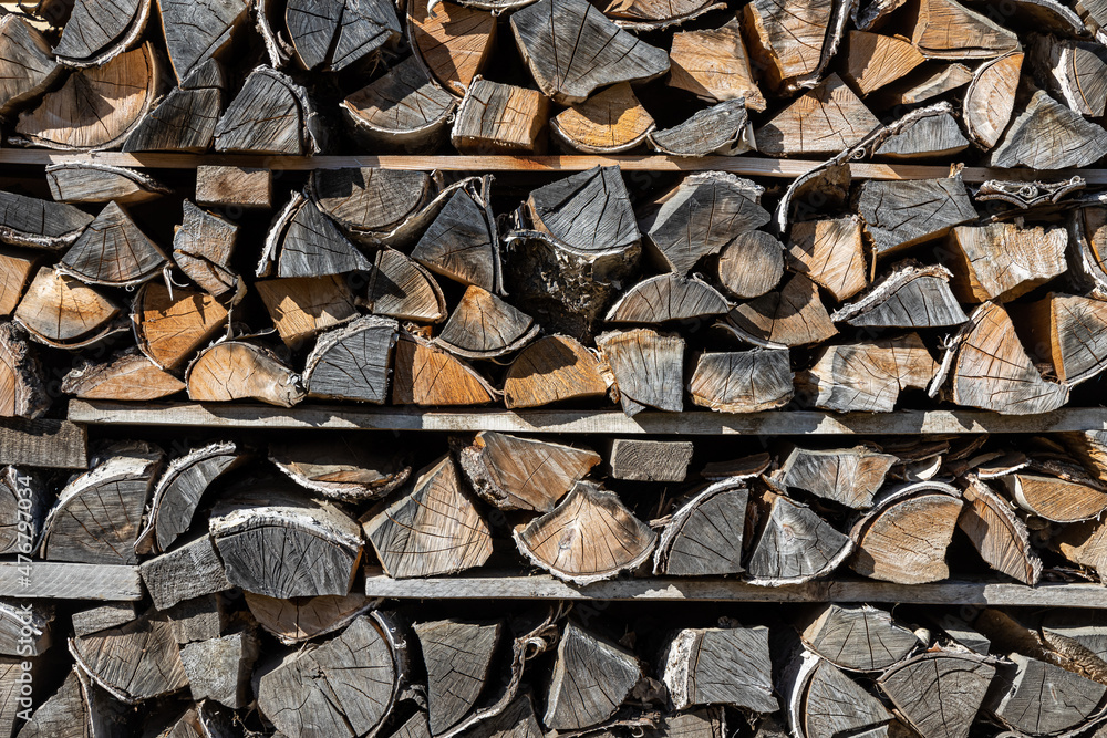 Firewood from chopped birch with bark and knots is in a woodpile Stock ...