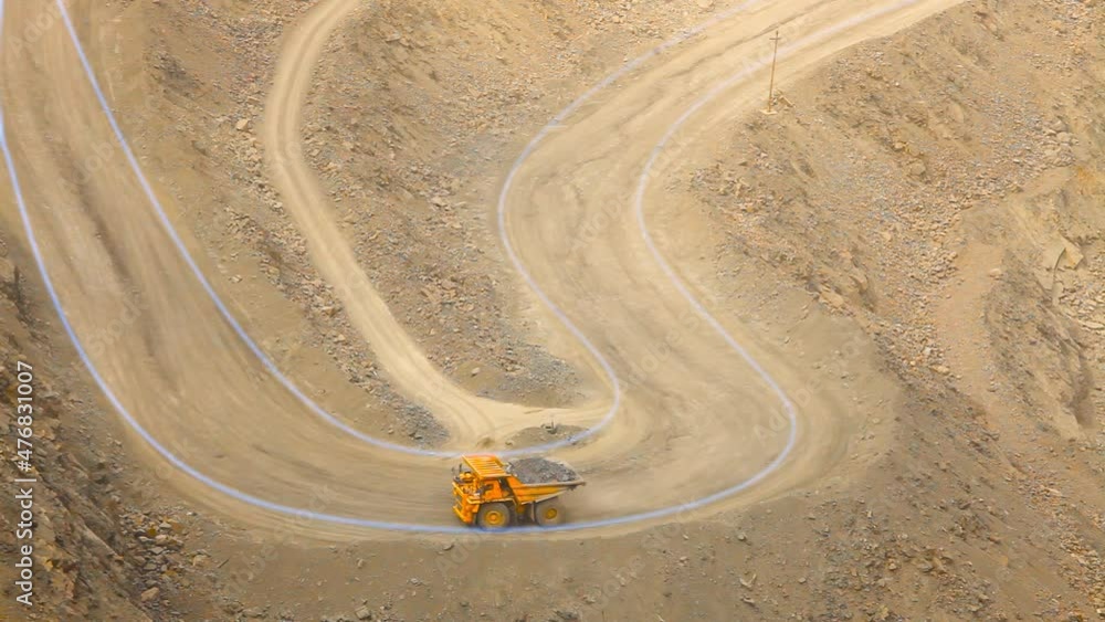 Visualization of a modern quarry. A dump truck drives through a large ...