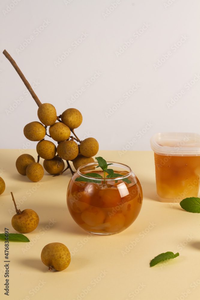 Longan drink in glass with fresh fruit peel the skin show white meat ...