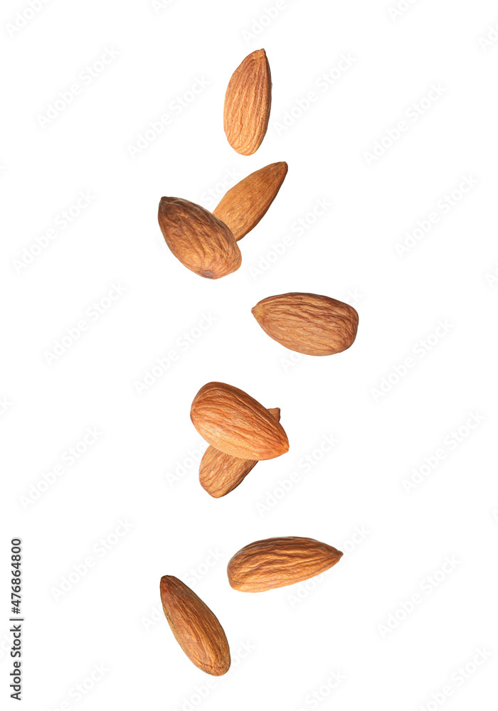 Many tasty almonds falling on white background Stock Photo | Adobe Stock