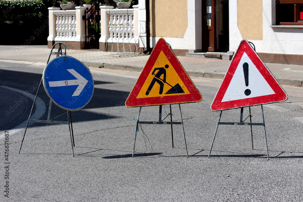 Old dilapidated heavily used directional road sign directing traffic ...
