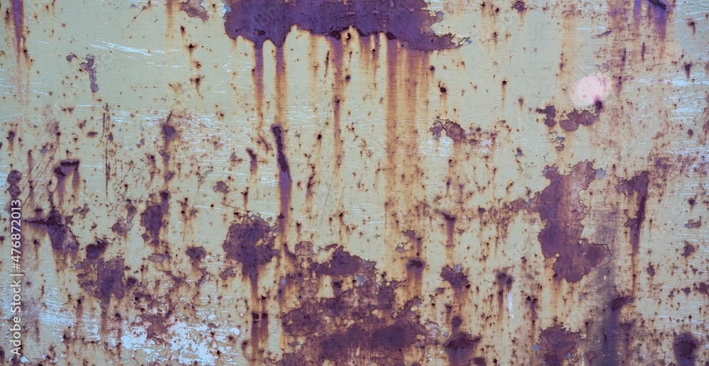 The texture of old rusty metal. Spots and streaks of rust on the light ...