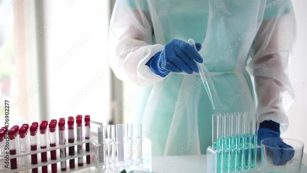 Close-up of a laboratory assistant registers the results of PCR tests ...