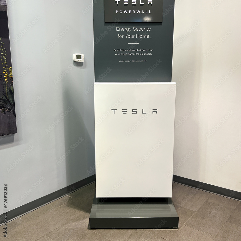 The Tesla Powerwall and Sign at the entrance of the Tesla dealership in ...