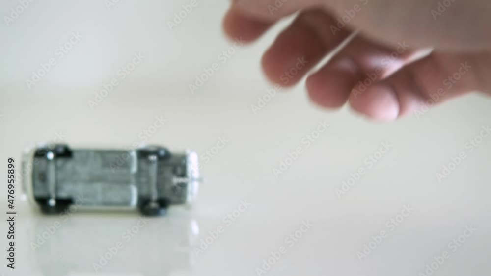 Hand pushing Suv,sedan car scale model simulates a serious road ...