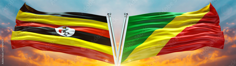 Uganda flag and Republic of the Congo Flag waving with texture sky ...