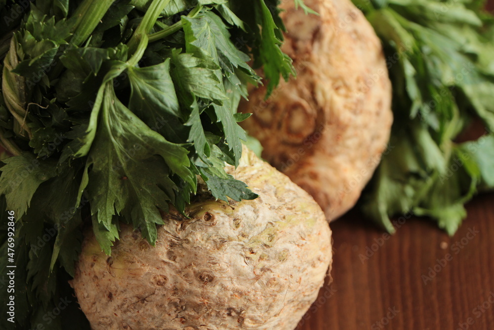 Celery root with leaf. Healthy food. Whole celeriac with leaves. Celery ...