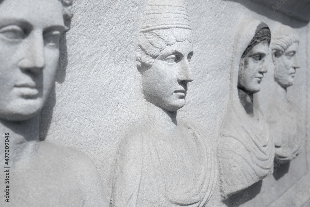 Ancient Greek marble bas relief with faces of women and men ...