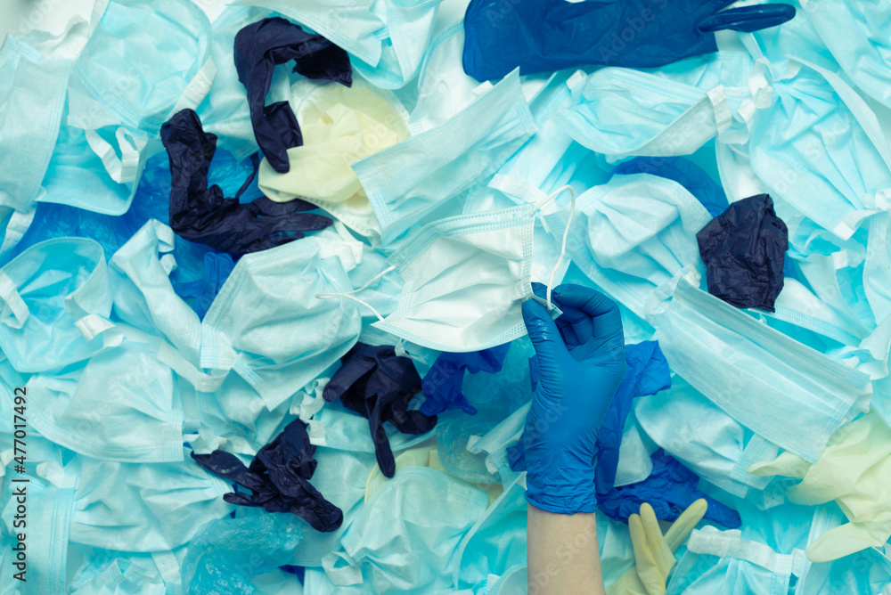 Waste of used personal protective equipment PPE, gloves, disposable ...