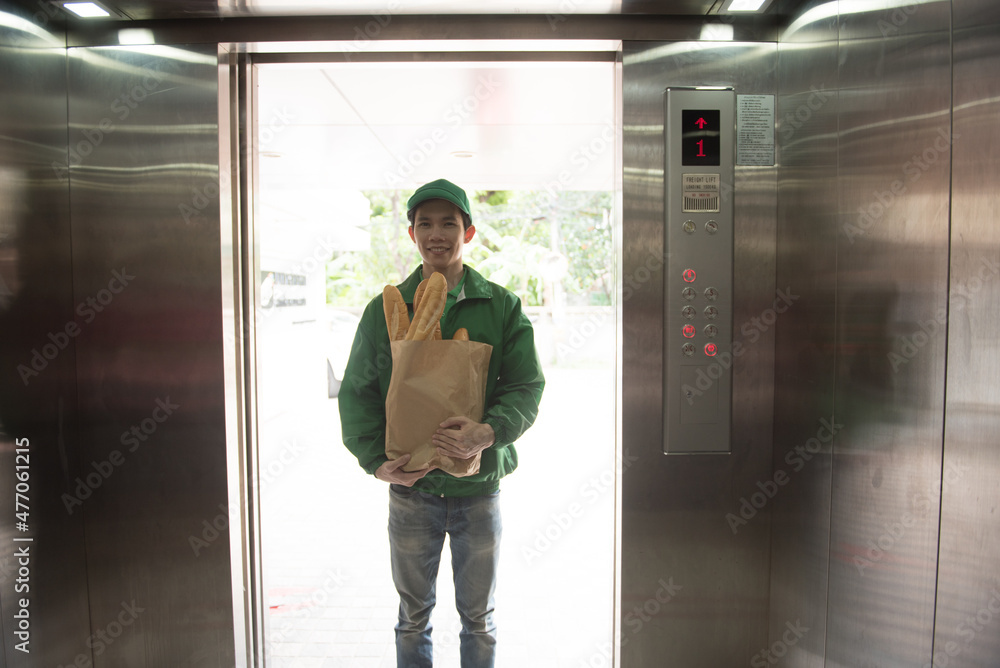 Food delivery staff deliver food, deliver bread to customers. by ...