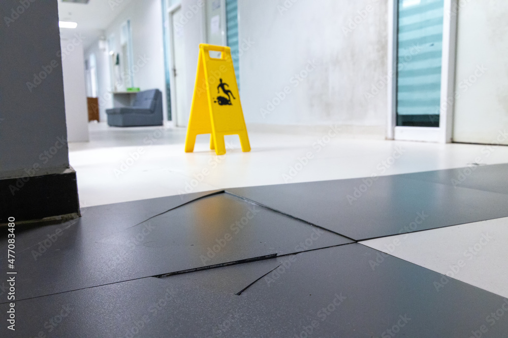 Fotka „Close-up ceramic tiles floor cracked and broken from concrete ...