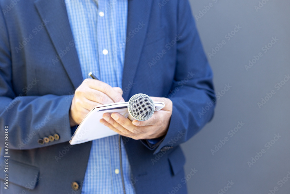 News Journalist Taking Notes