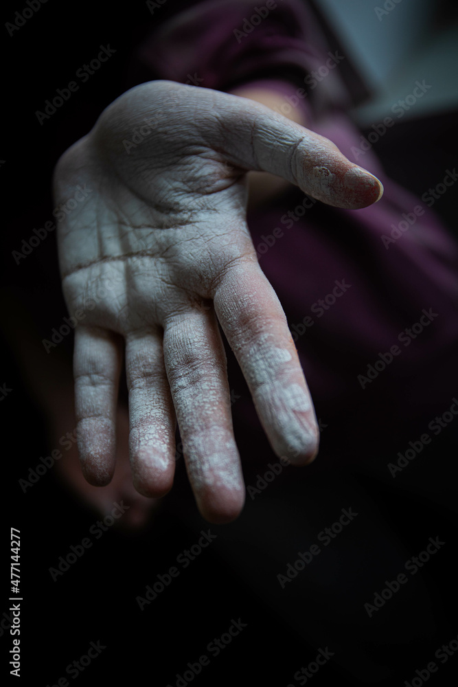 beautiful women's hands smeared in white paint after working with their ...