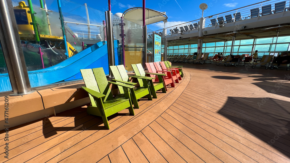 Colorful chairs in the family pool area on the Royal Caribbean RCL ...