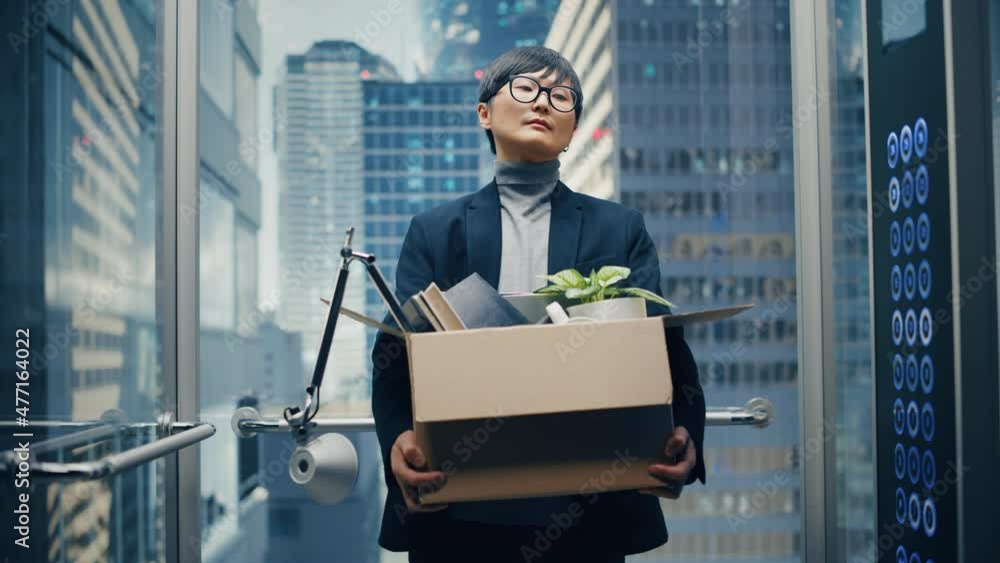 Fired Manager Going Down from Office in a Glass Elevator in Modern ...
