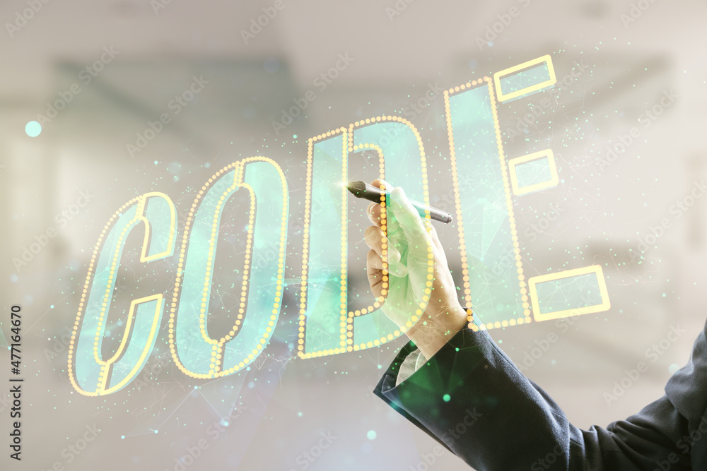 Man hand with pen writes Code word hologram on blurred office ...