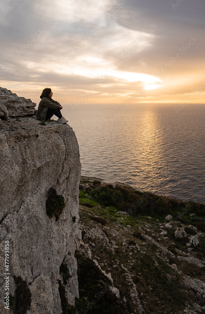 Sad Girl Standing On Cliff