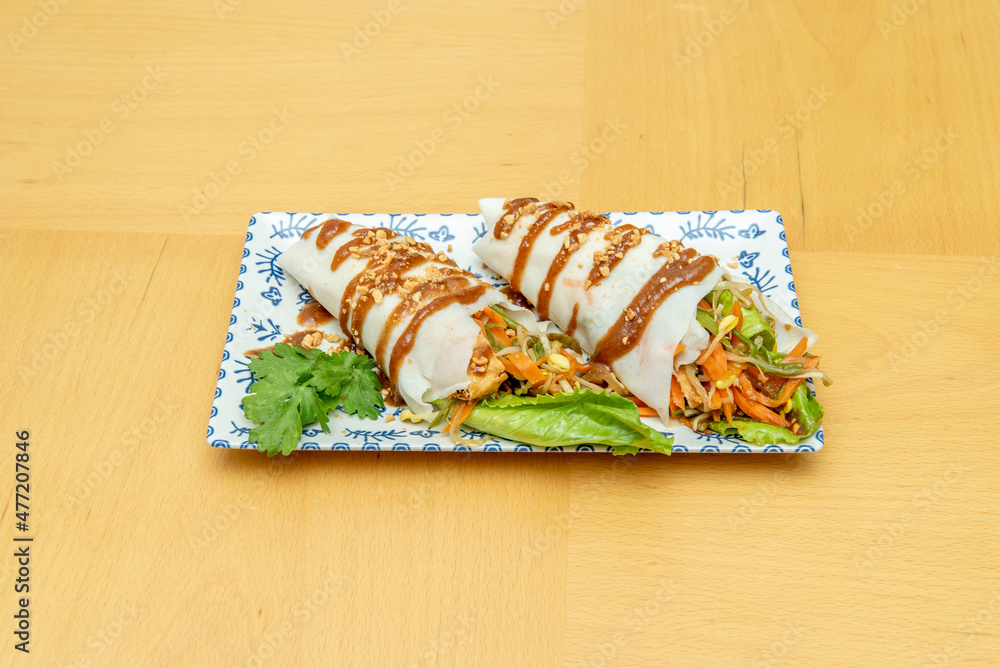 The spring roll, rolled spring or chun kun, similar to lumpiá, is a ...