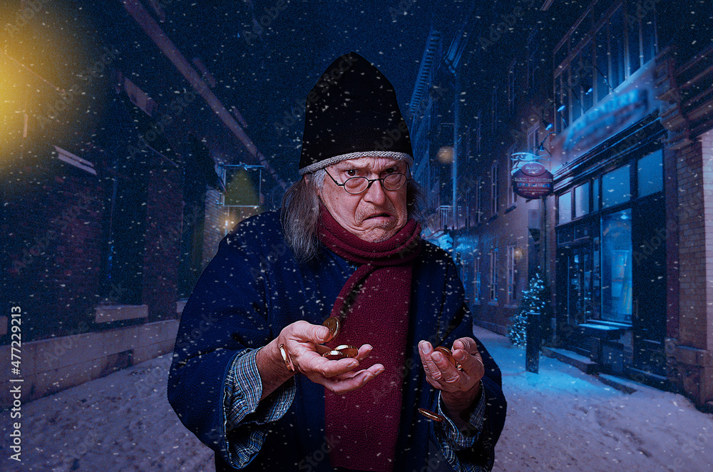 Scrooge holding gold coins, walking in street under the snow on a ...