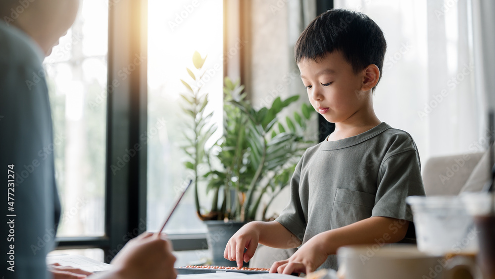 Asian boy Learning math with an abacus, education concept, home school ...