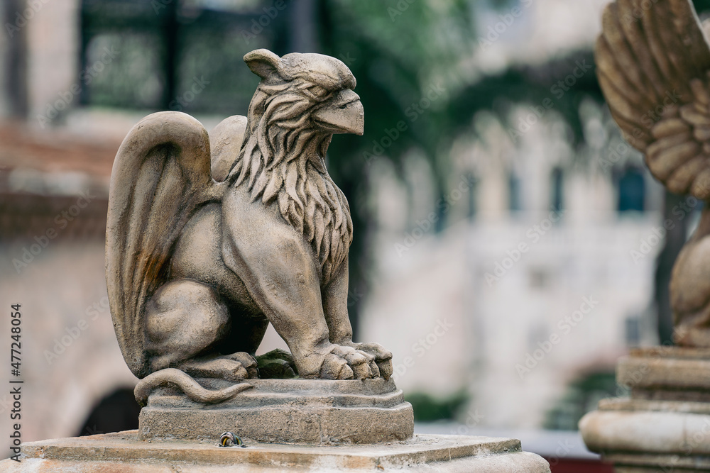 Gargoyle statue, chimeras, in the form of a medieval winged monster ...