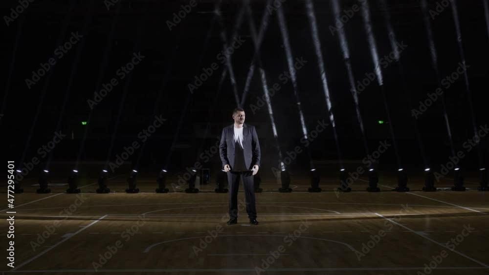Famous Showman, artist in black suit performs on stage 4K. The ...