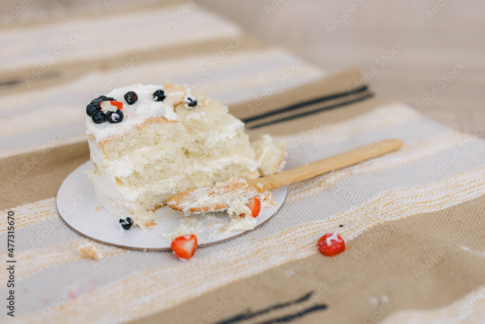 broken white cake. crash cake. at the celebration of the girl's first ...